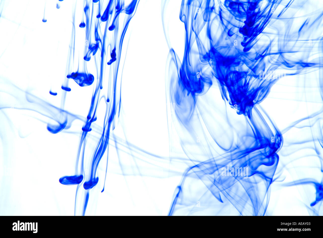 Coloured ink in water creating graphic swirling patterns Stock Photo ...