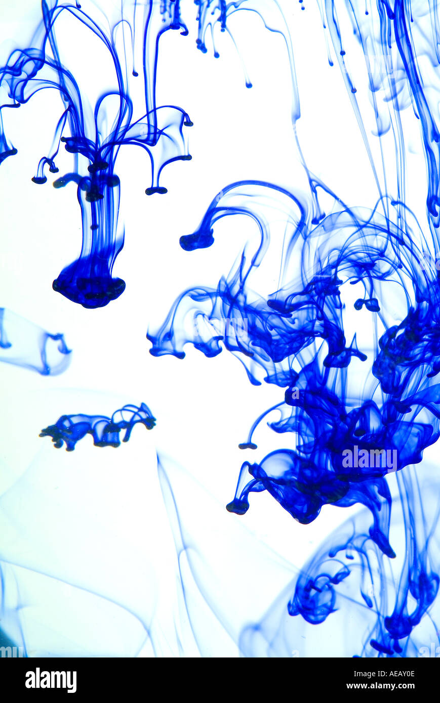 Coloured ink in water creating graphic swirling patterns Stock Photo ...