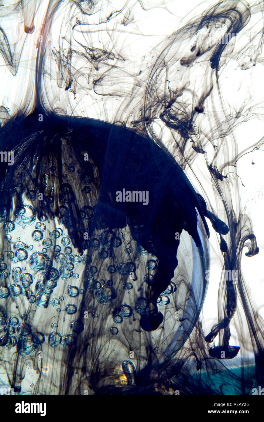 Coloured ink in water creating graphic swirling patterns Stock Photo ...