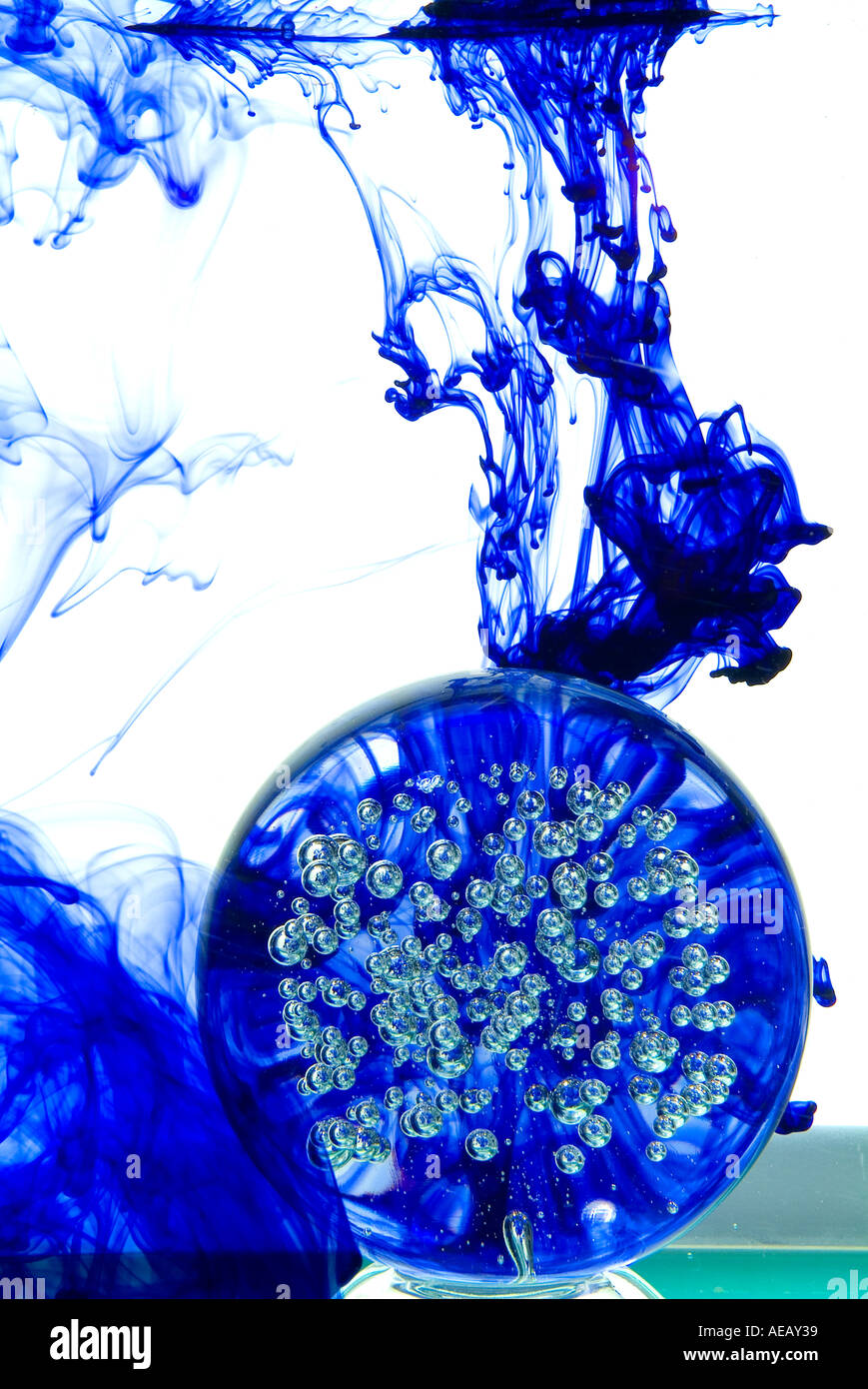 Coloured ink in water creating graphic swirling patterns Stock Photo ...