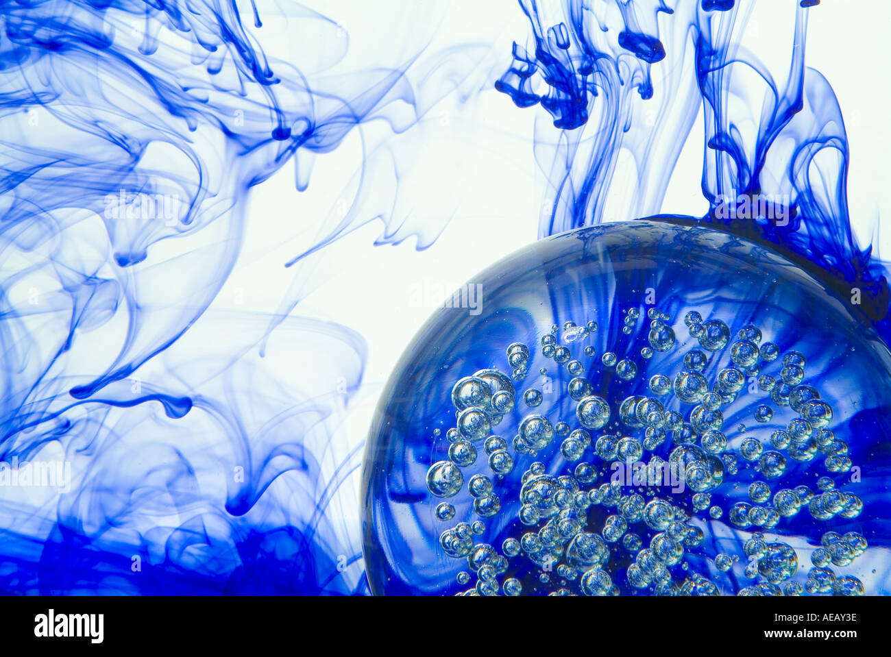 Coloured ink in water creating graphic swirling patterns Stock Photo ...