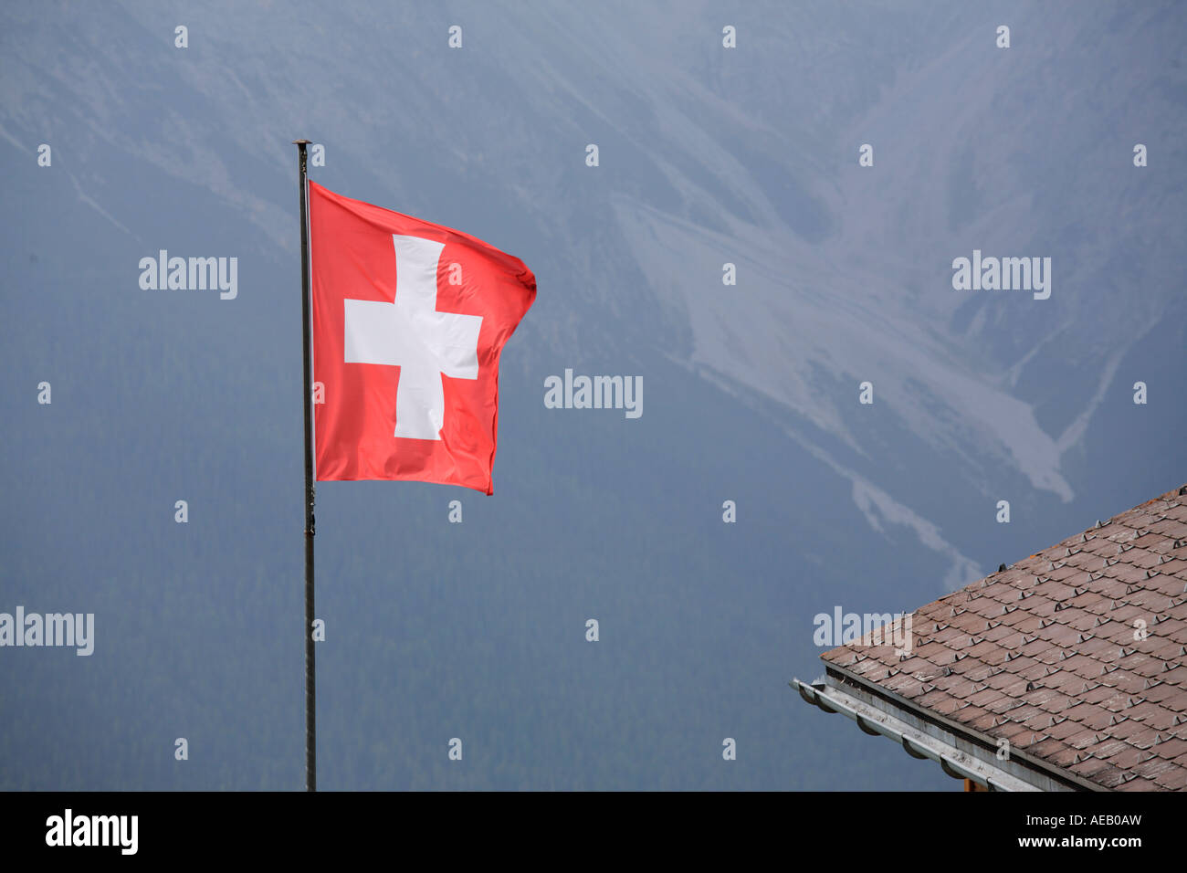 Swiss national flag with the Alps background, Switzerland Stock Photo ...