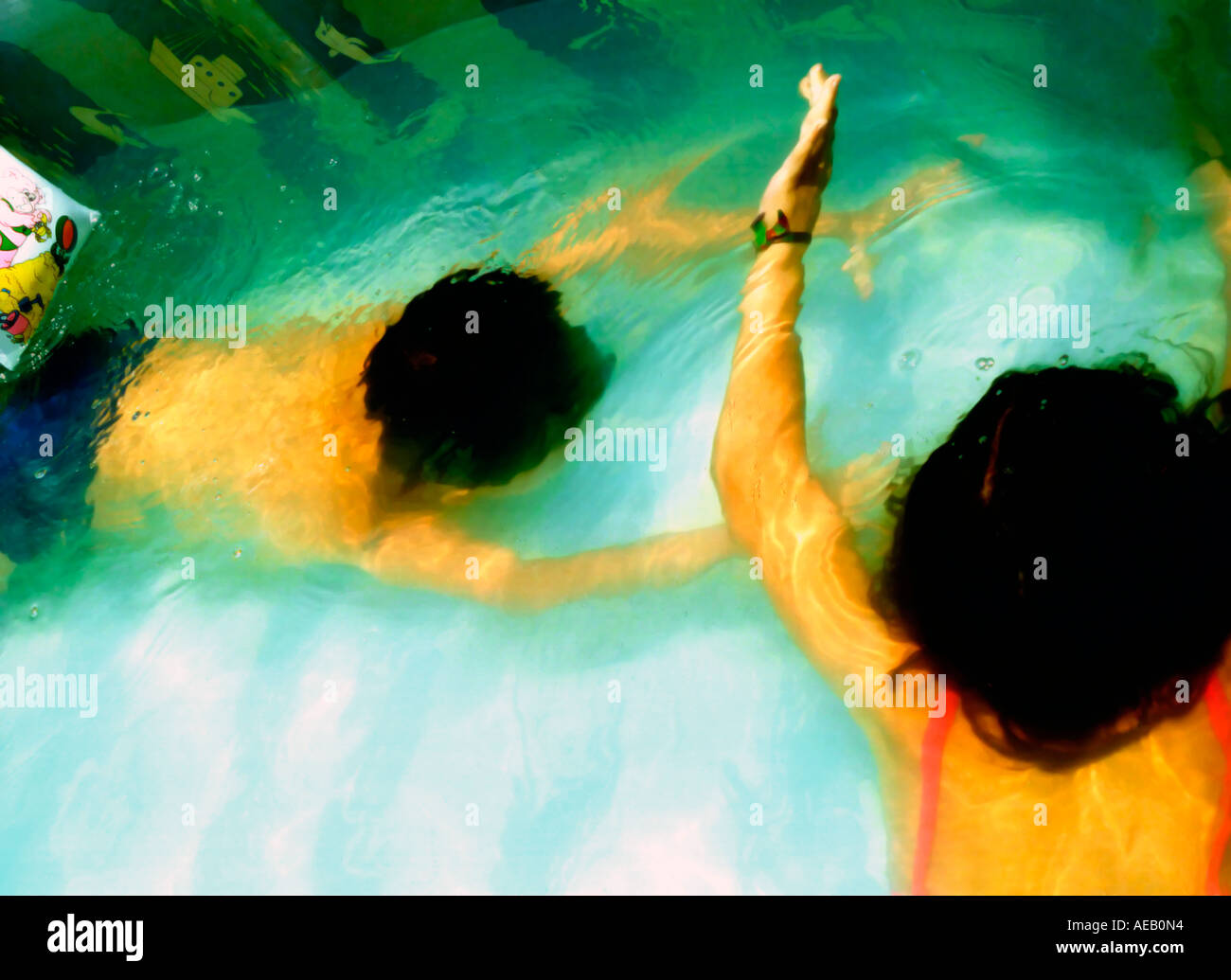 Boy and girl underwater portrait hi-res stock photography and images ...