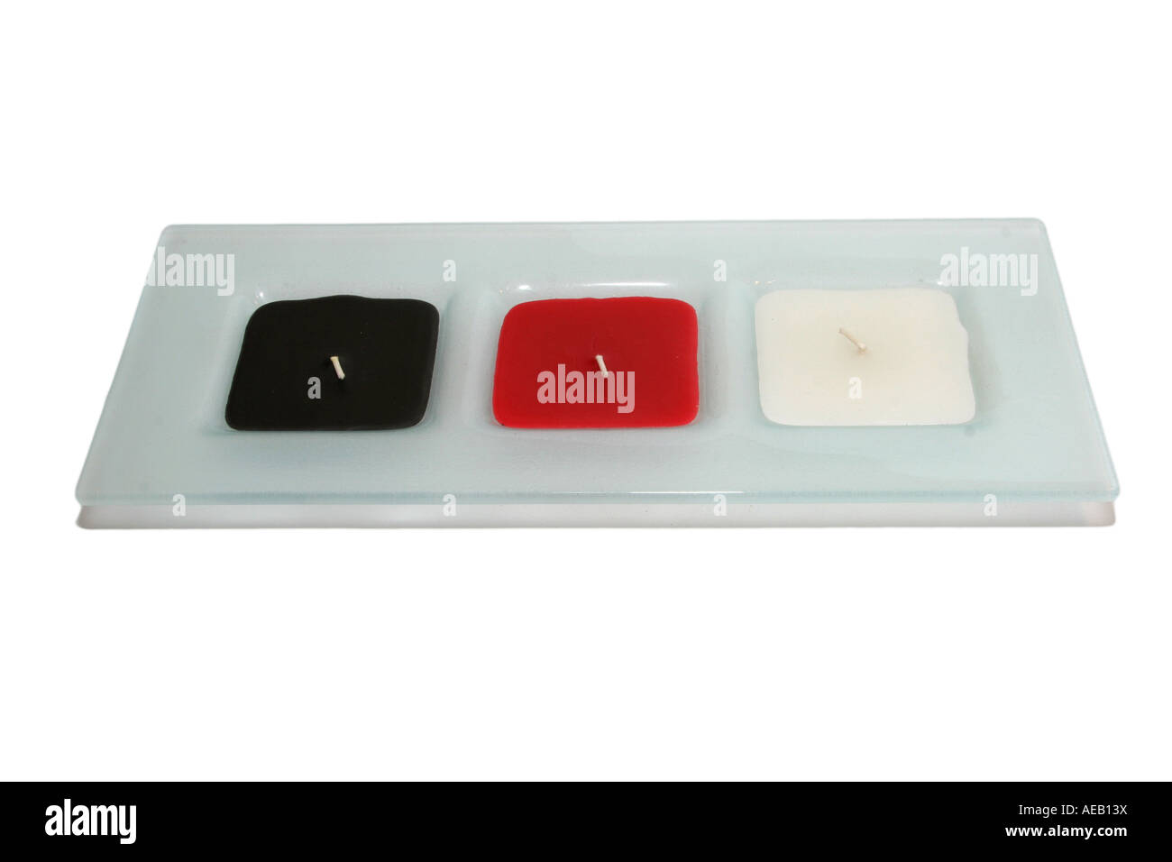 rectangular candle holder with three square candles Stock Photo - Alamy