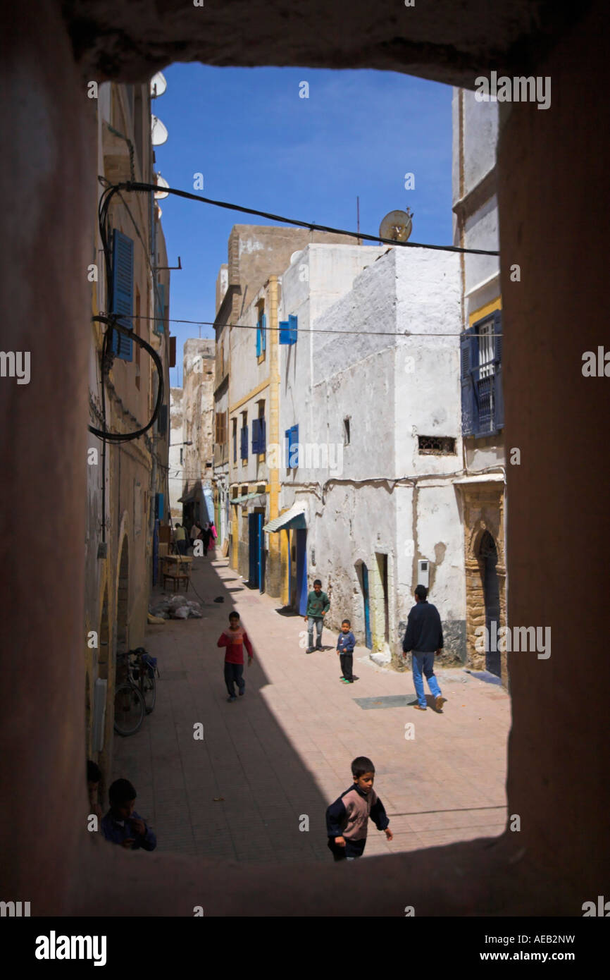 Back street scene framed through a window in Essaouira in Morocco in ...