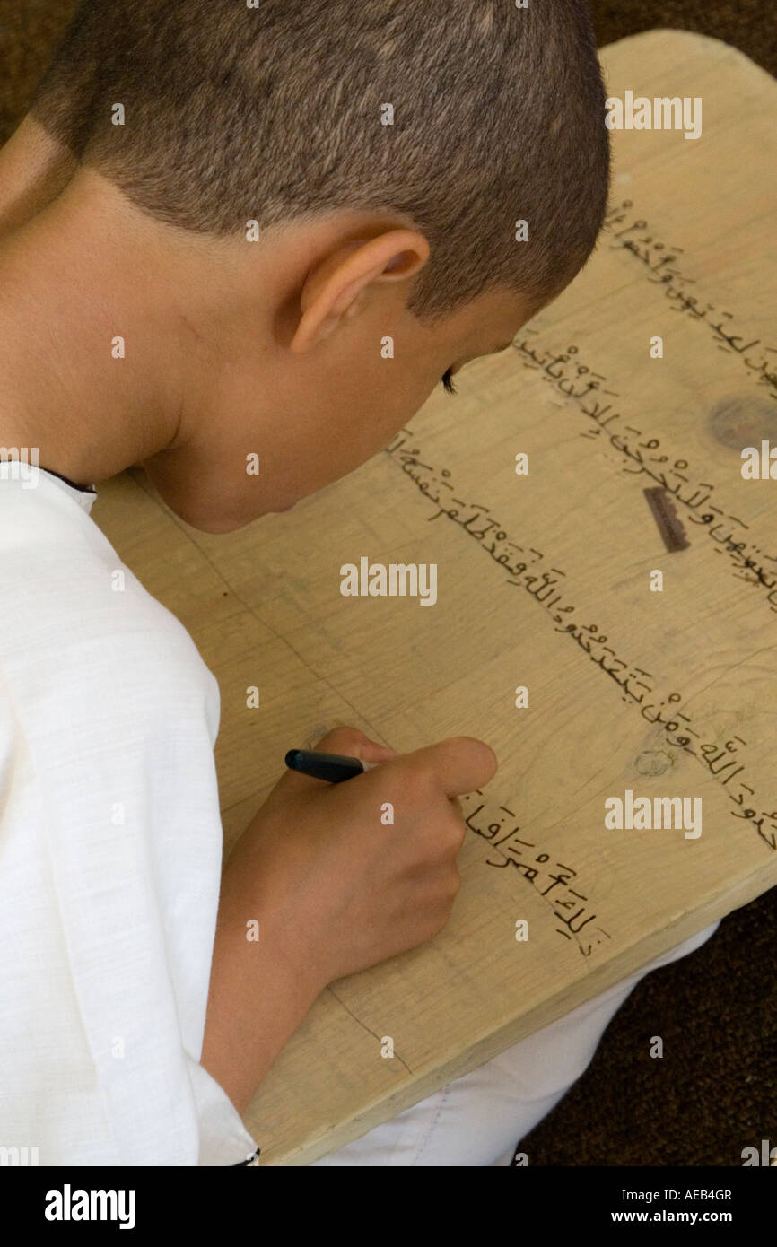 Zliten, Libya. Boy Writing Koranic Verses on his Prayer Board in the ...