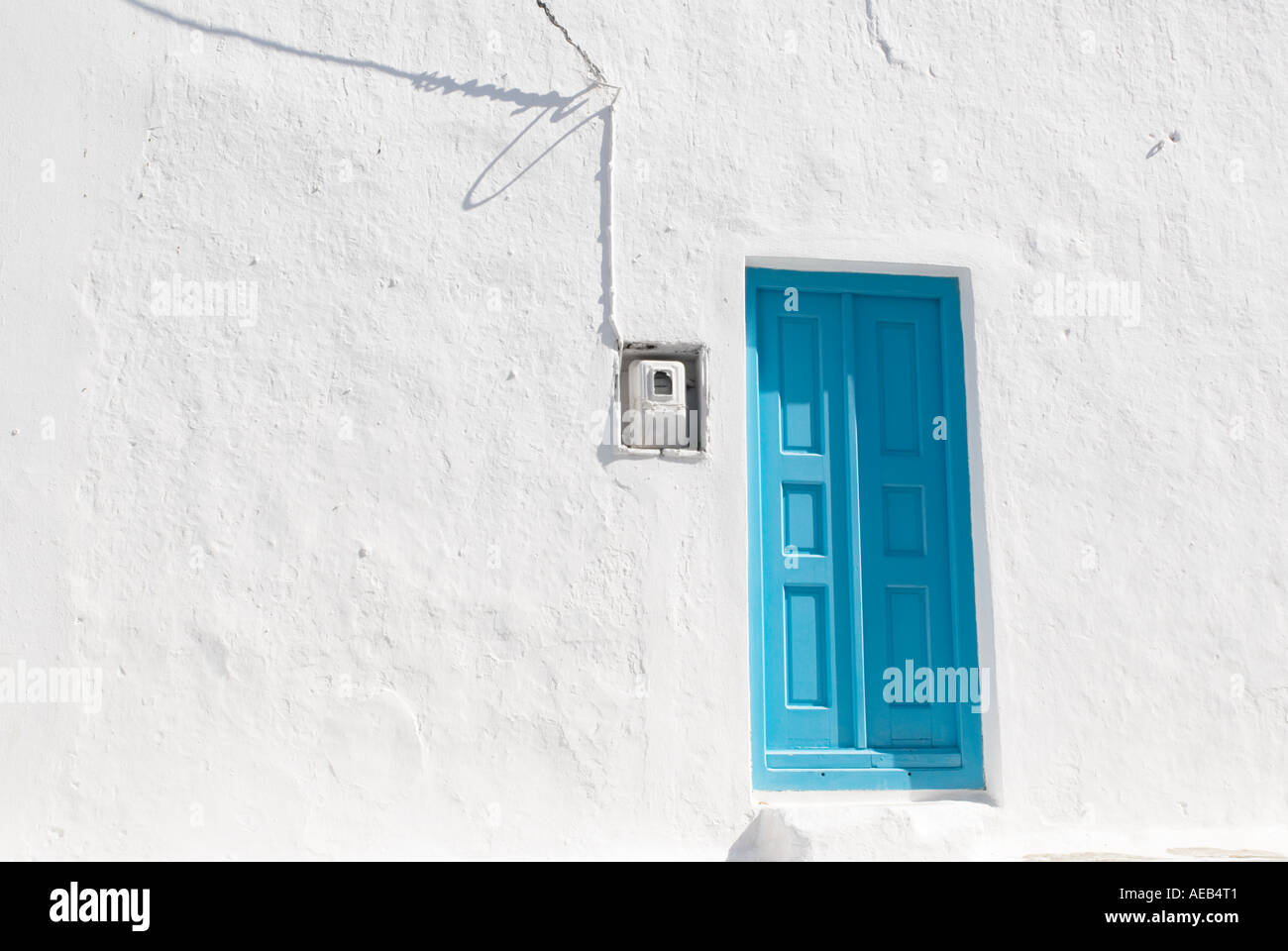 Graphic abstract Greek window against a white washed traditional ...