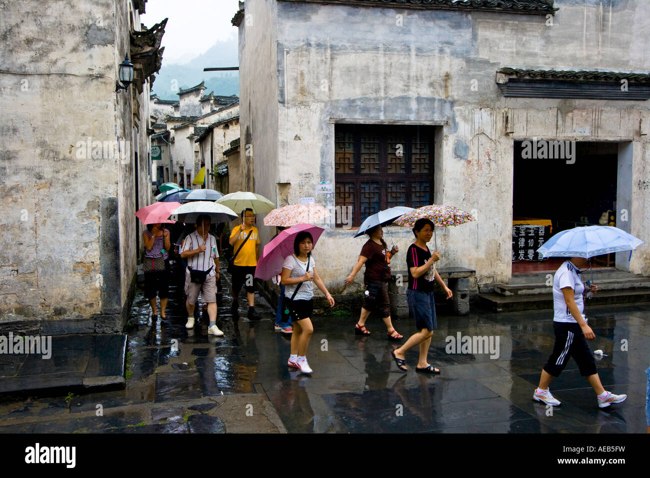 Chinese Tour Group in the Rain Ancient Huizhou Style Chinese Village ...