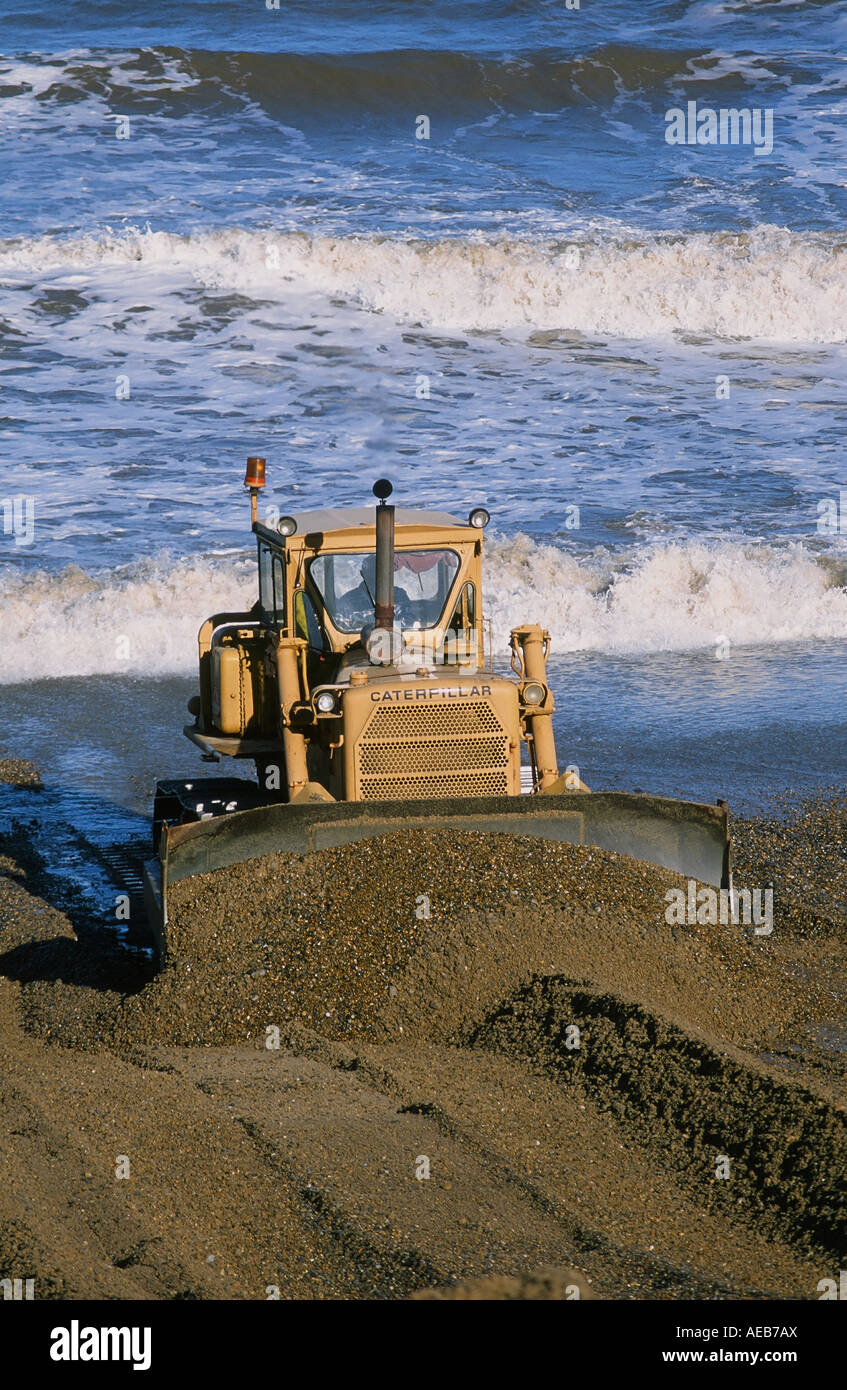 Bull dozer building up the storm beach near Cley to protect from winter ...