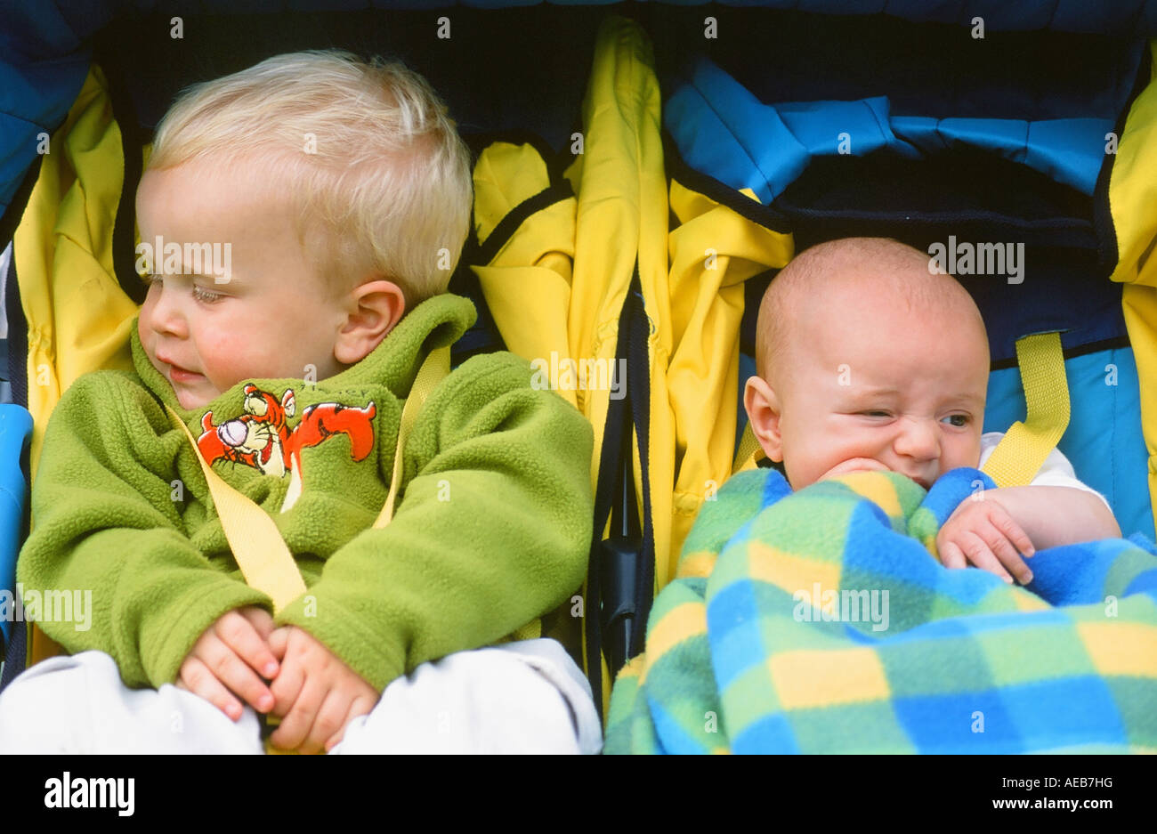 Children in a double buggy pushchair Stock Photo - Alamy