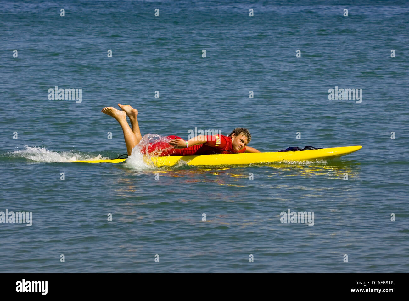 An RNLI lifeguard on patrol Stock Photo - Alamy