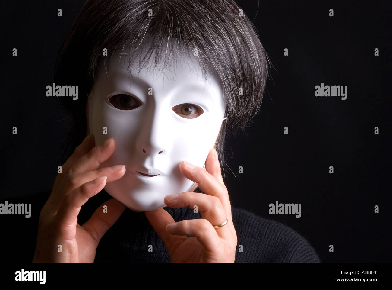 Behind the mask hi-res stock photography and images - Alamy