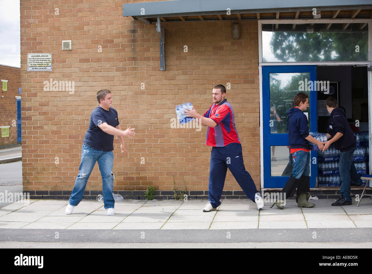 Residents receiving drinking water in Tewkesbury Stock Photo - Alamy