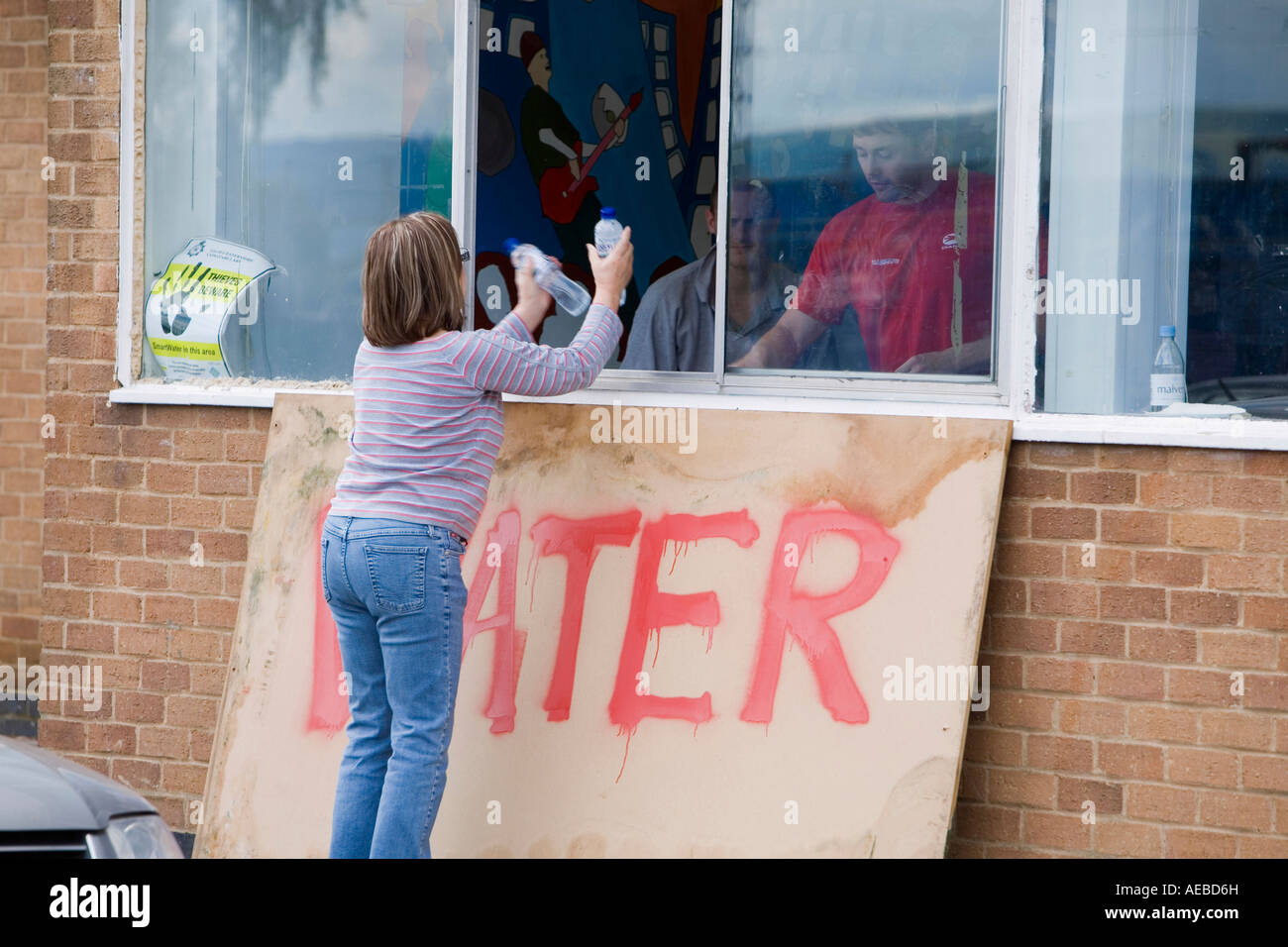 Residents receiving drinking water in Tewkesbury Stock Photo - Alamy