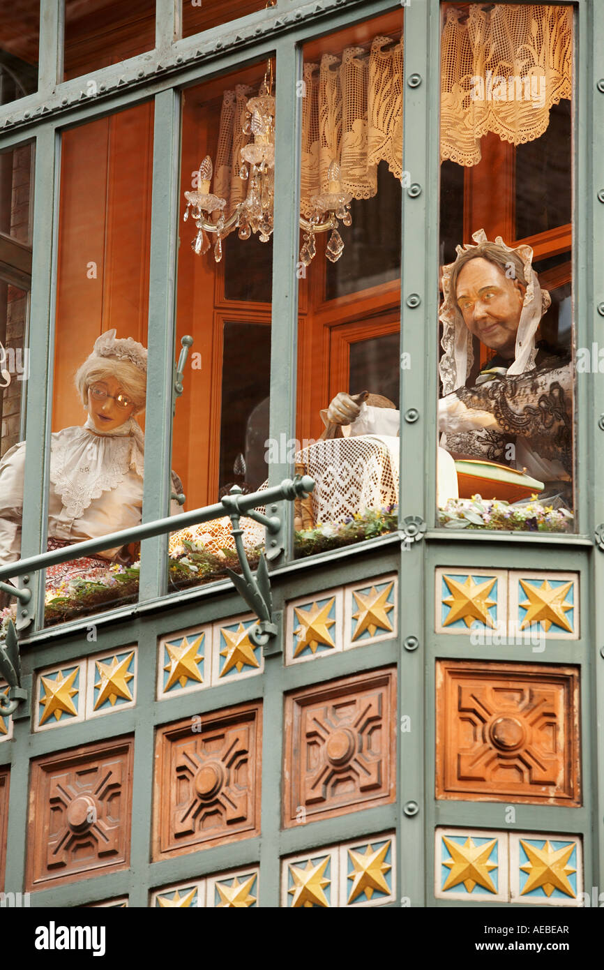 Balcony of lace shop with ladies working on their lace Wollestraat ...