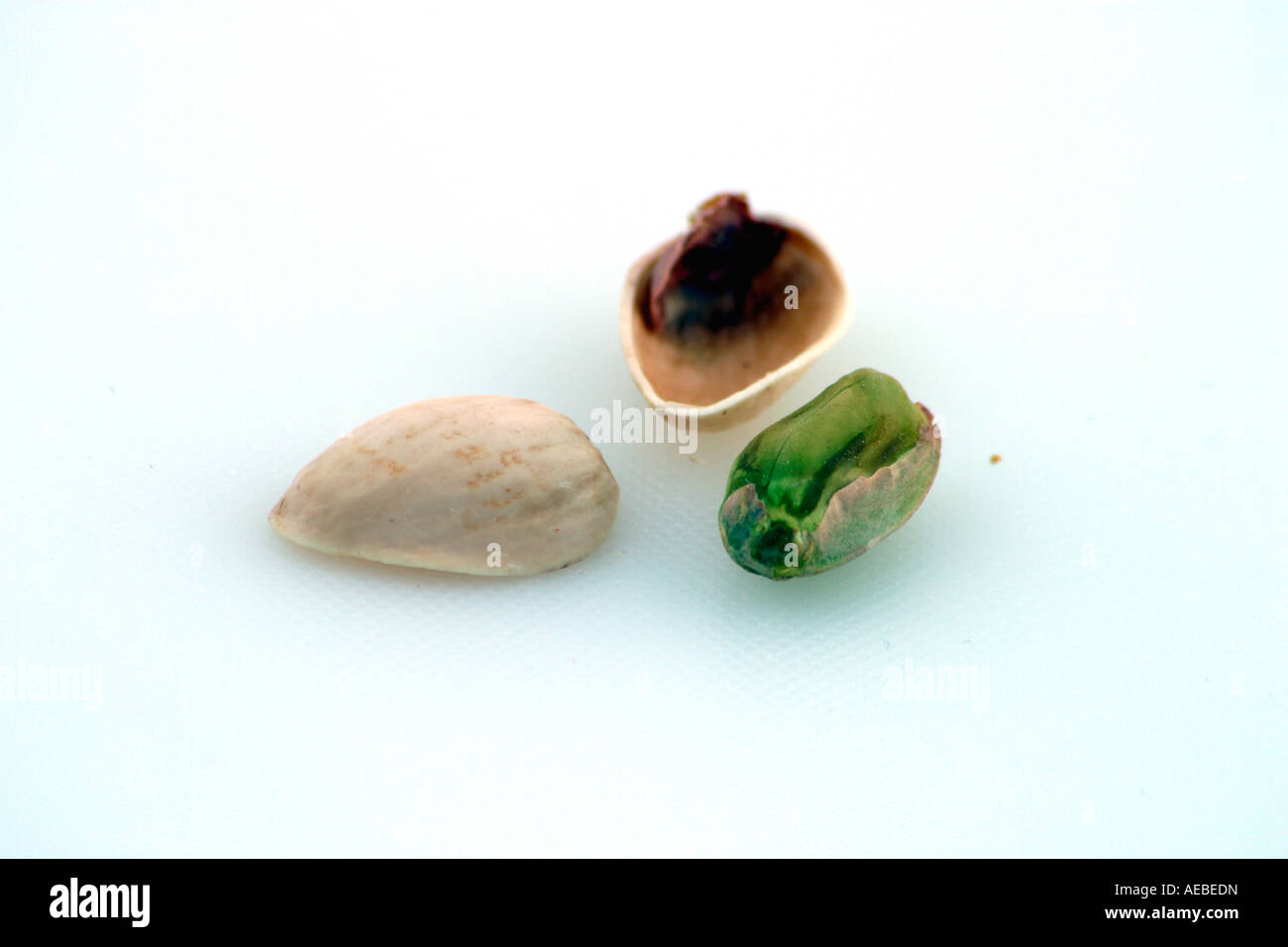 Pistashio nut out of its shell on a white background Stock Photo - Alamy