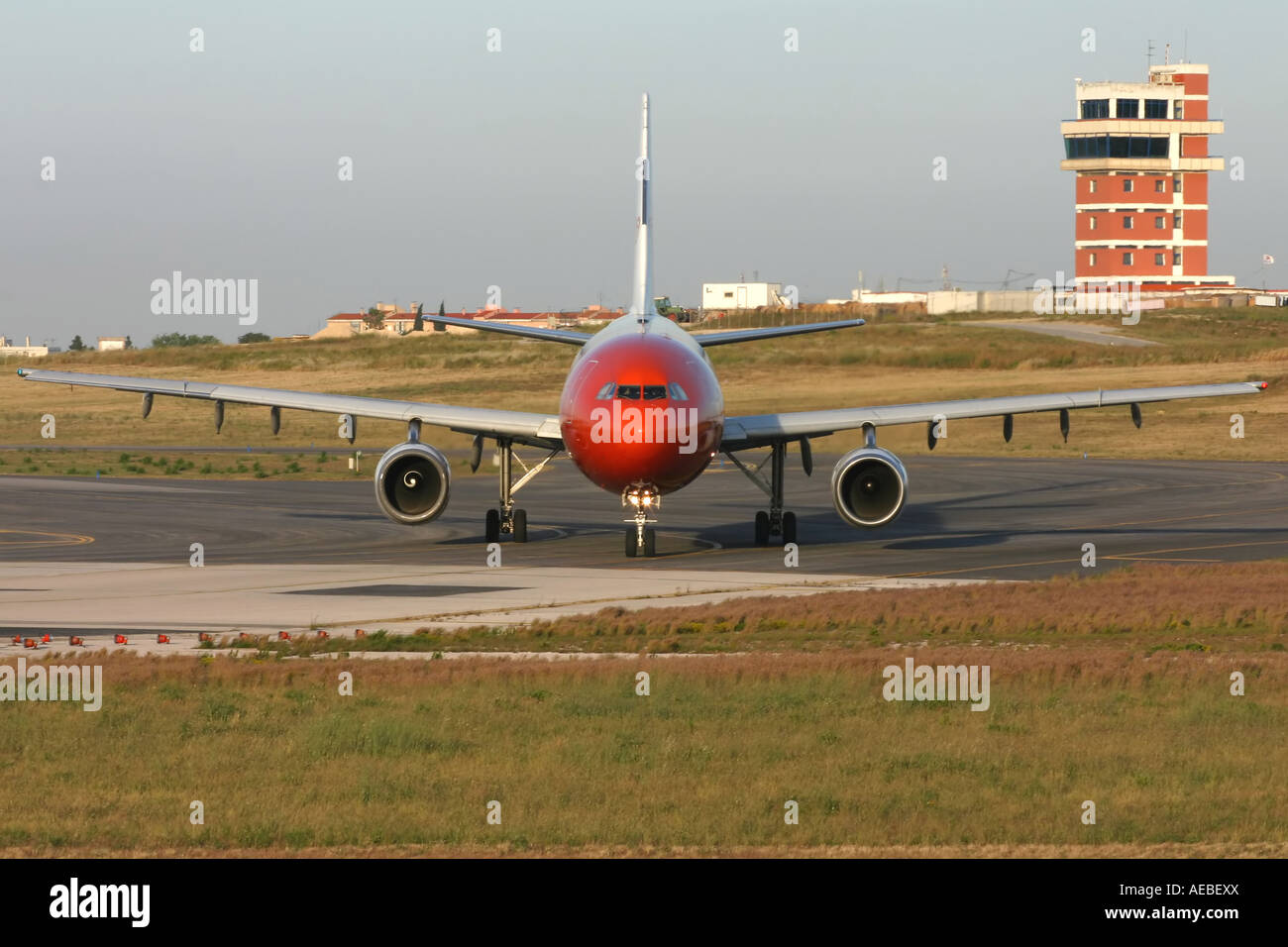 commercial aircraft with a red nose Stock Photo - Alamy