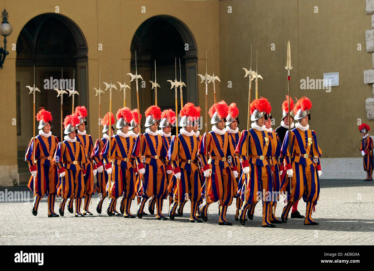 SWISS GUARDS IN PLUMED HELMETS AND STRIPED UNIFORMS AT THE VATICAN CITY ...