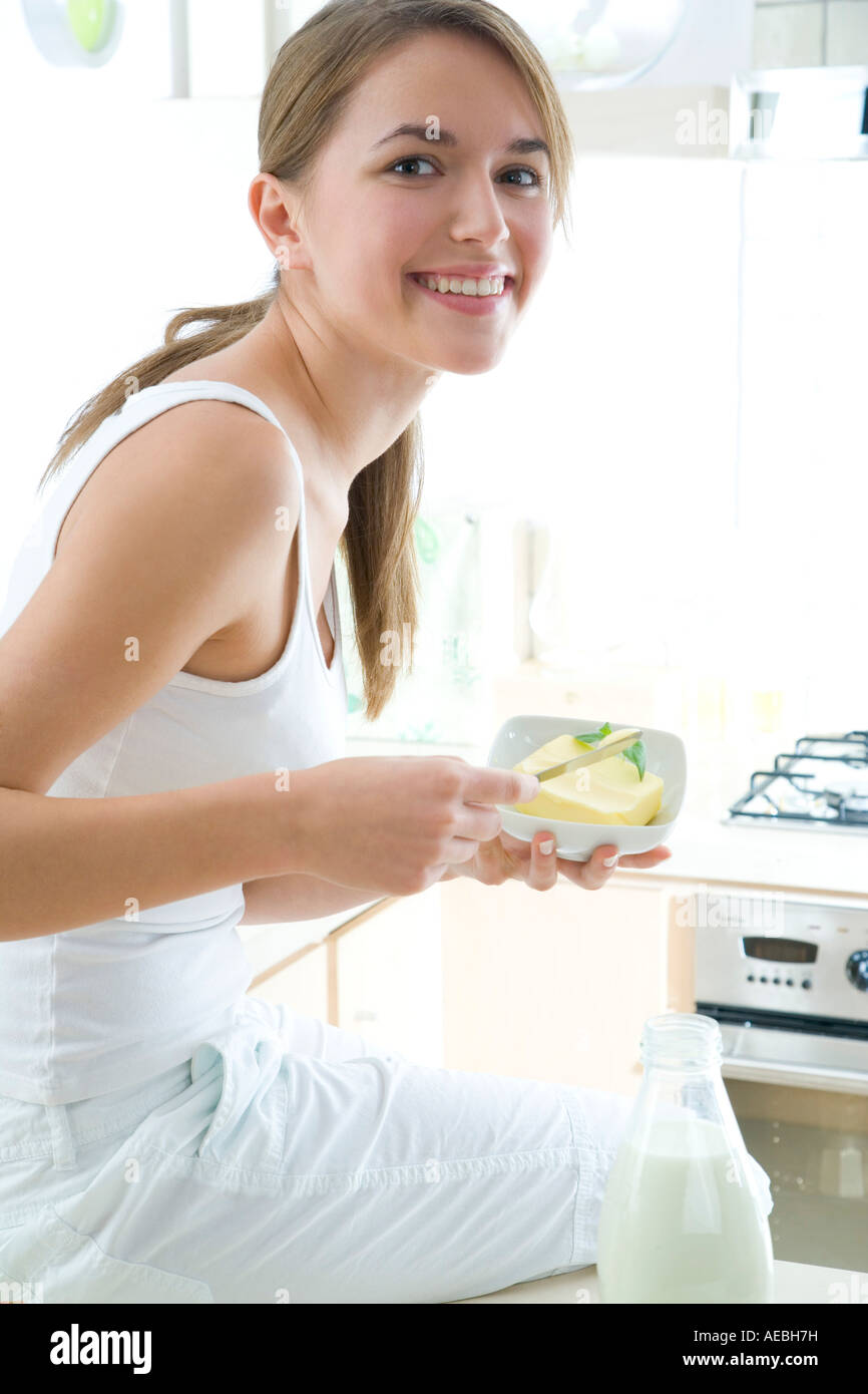 young woman holding butter Stock Photo - Alamy