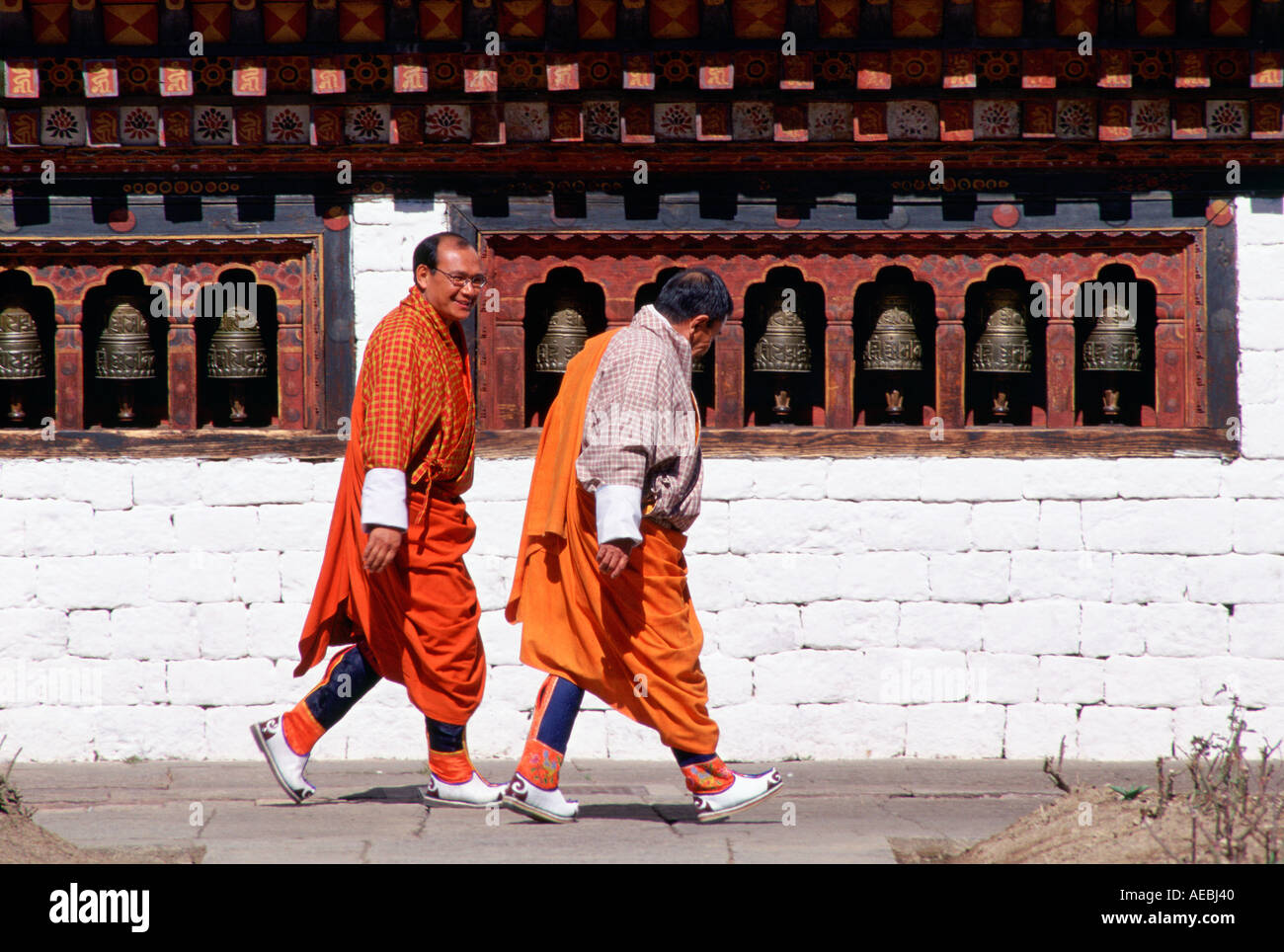 Two men wearing traditional clothing in Paro Bhutan Stock Photo - Alamy