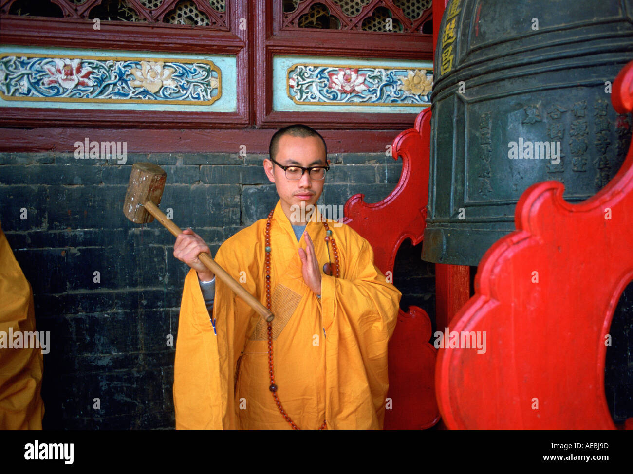 Man ringing temple bell hi-res stock photography and images - Alamy