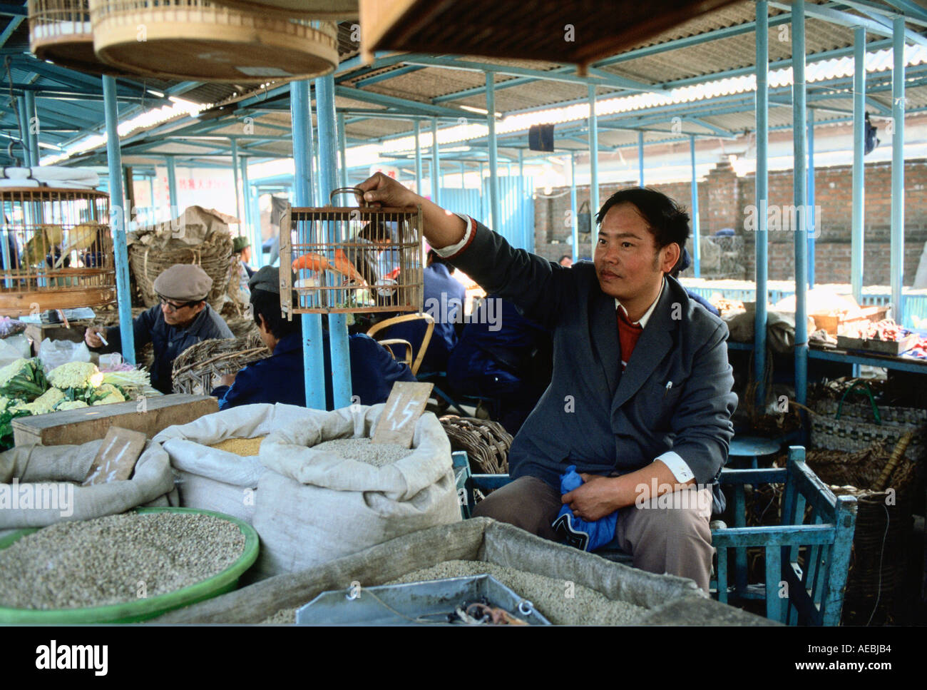 Chinese market trader cage hi-res stock photography and images - Alamy