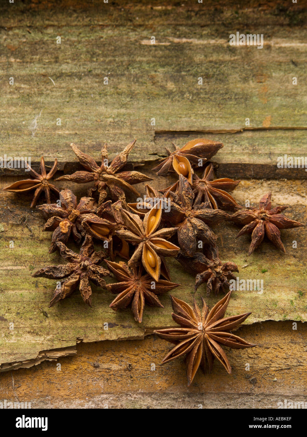 Chinese Star Anise on a rough wooden background Stock Photo - Alamy