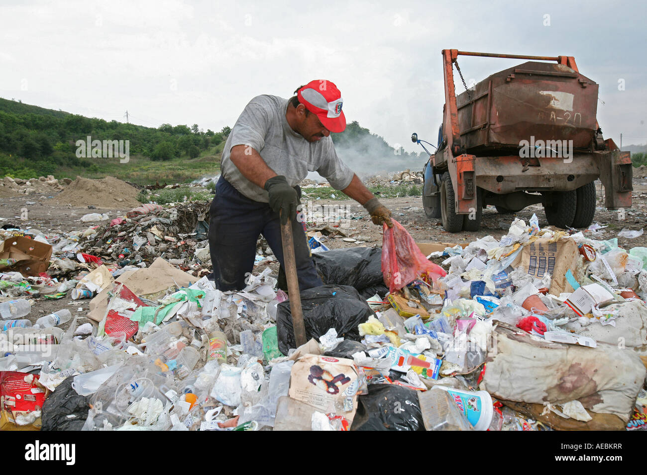 Poor Roma people trying to make a living by collecting garbage from a ...