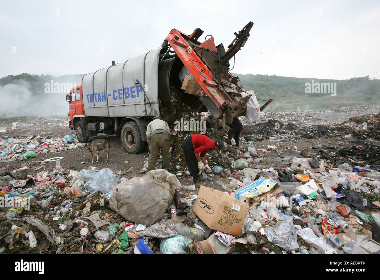 Poor Roma people trying to make a living by collecting garbage from a ...