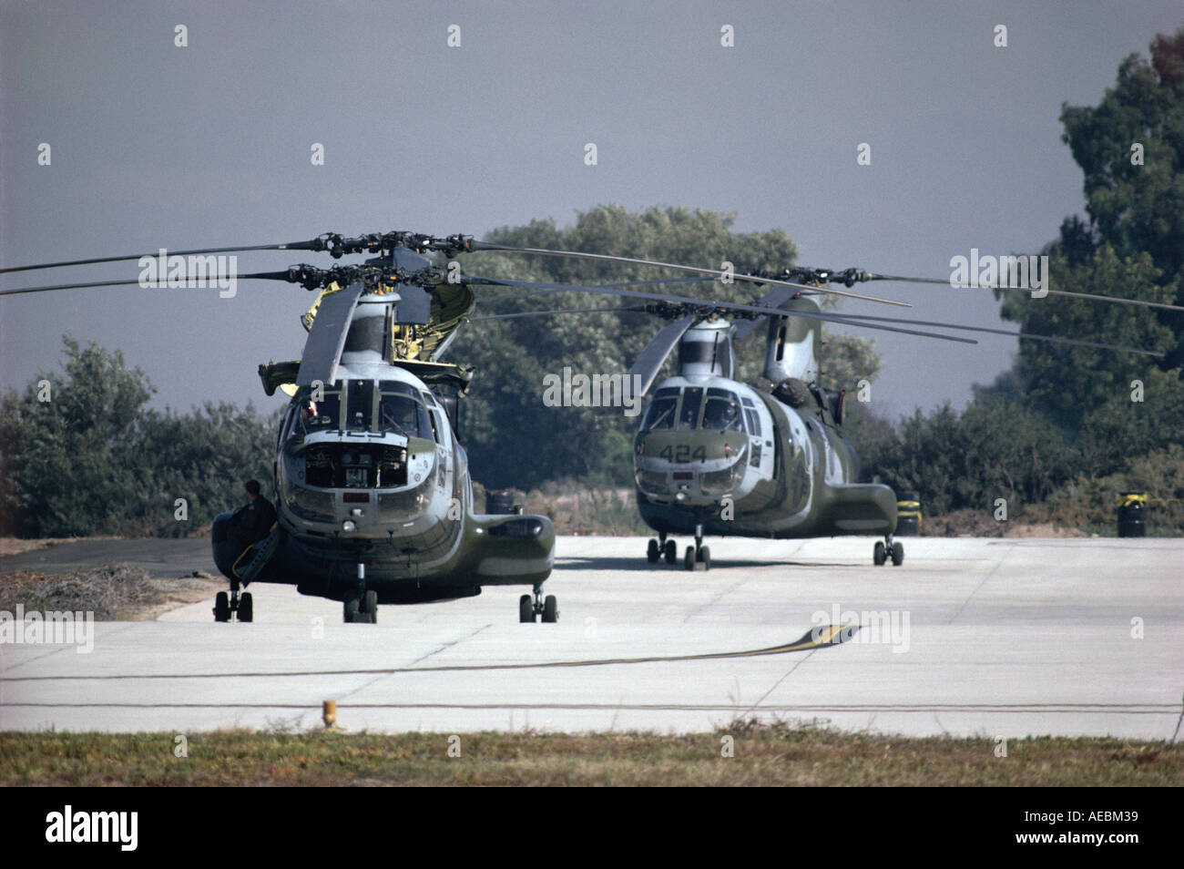 Two CH 46 Sea Knight helicopters parked on a ramp prior to a mission ...