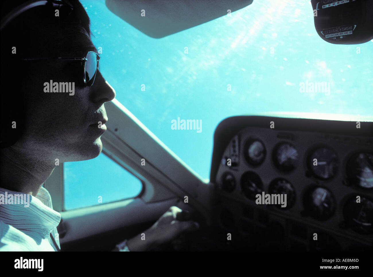 A pilot keeping a lookout and maneuvering to avoid other aircraft Stock ...