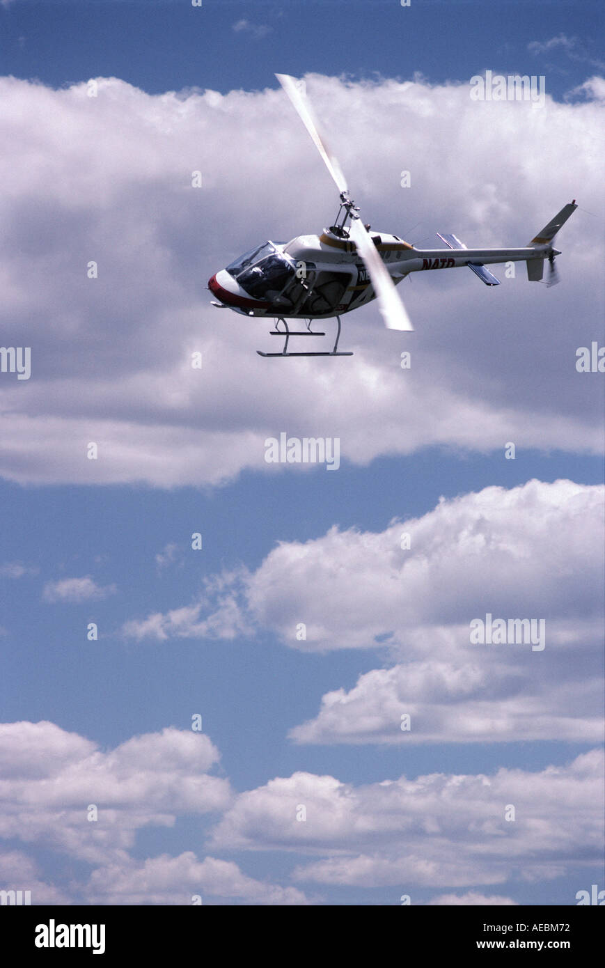 A television news helicopter flying Stock Photo - Alamy