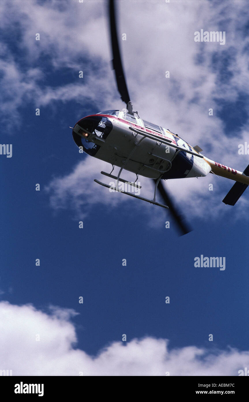 A television news helicopter flying Stock Photo - Alamy