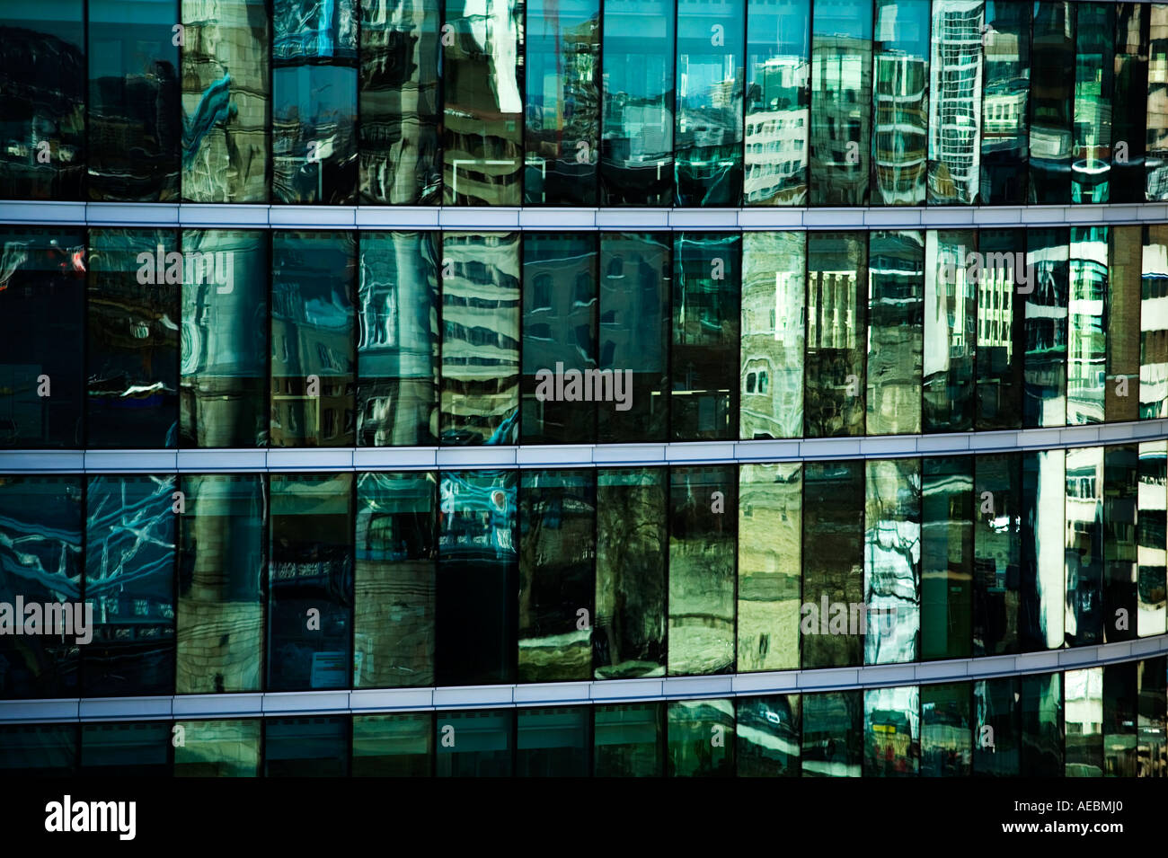 Reflections on a building's large window, London, England, United ...