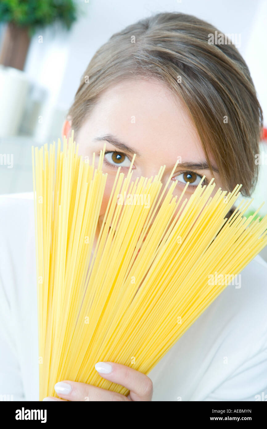 girl hiding behind pasta Stock Photo - Alamy