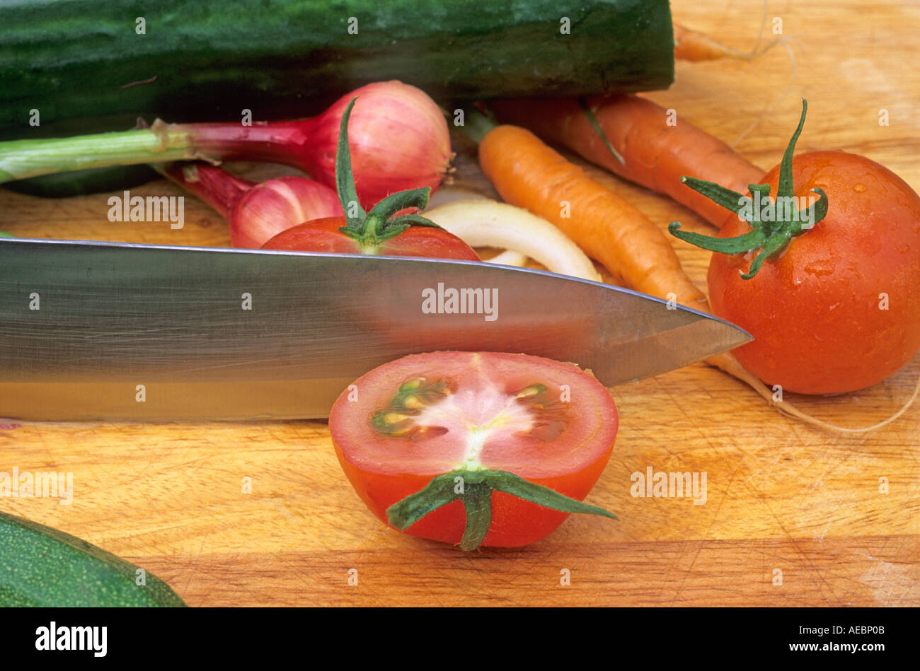 Cutting salad vegetables in the summer kitchen Stock Photo - Alamy