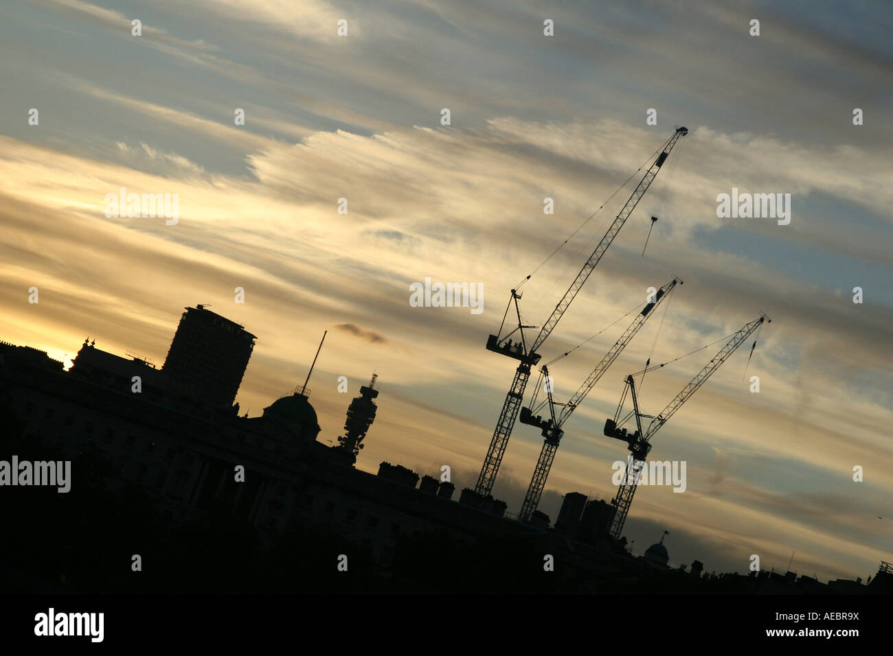 Silhouette of London skyline with dramatic sky and cranes Stock Photo ...