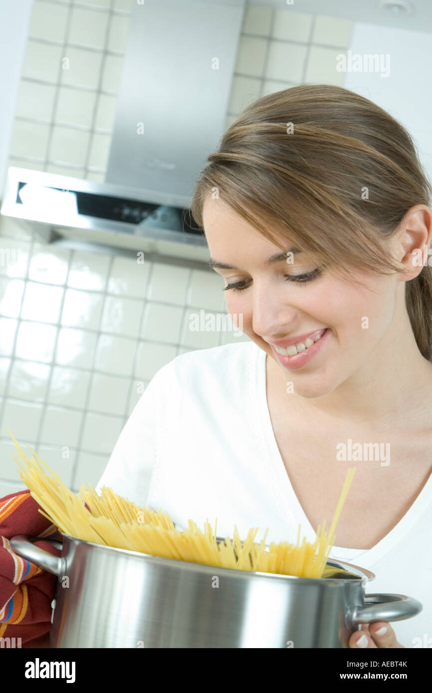 woman cooking spaghetti Stock Photo - Alamy