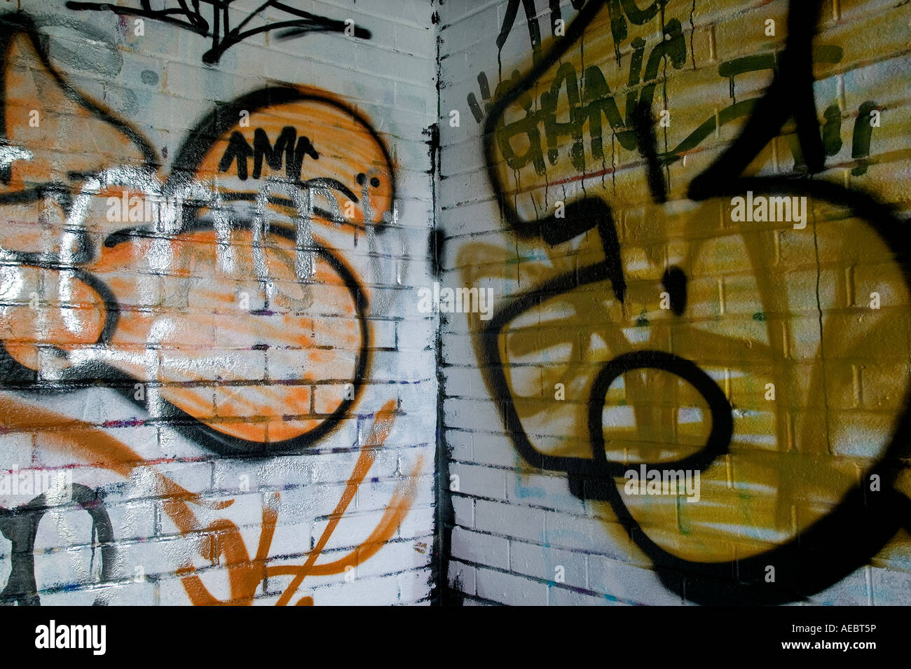 Graffiti in the corner of a brick wall Stock Photo - Alamy