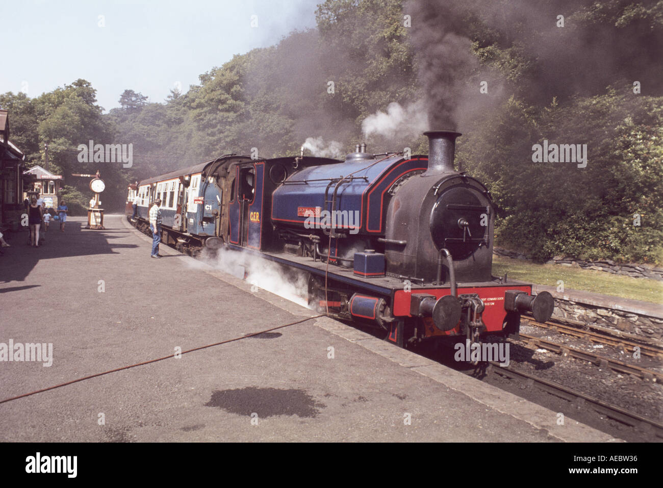 Steam engine pulling up to the platform, outside Stock Photo - Alamy