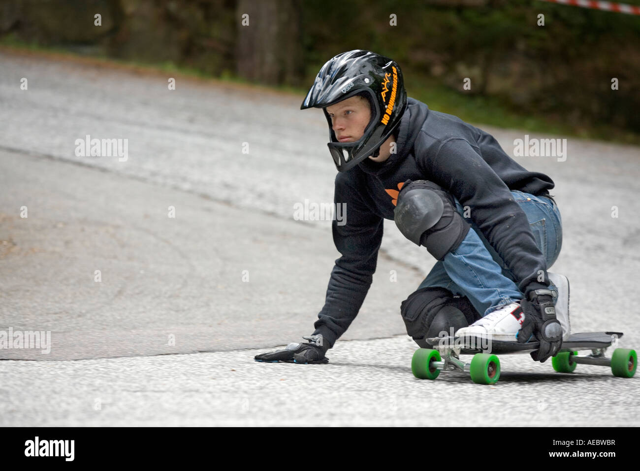 Skater takeing curve in full speed Downhill Longboard Skateboard ...