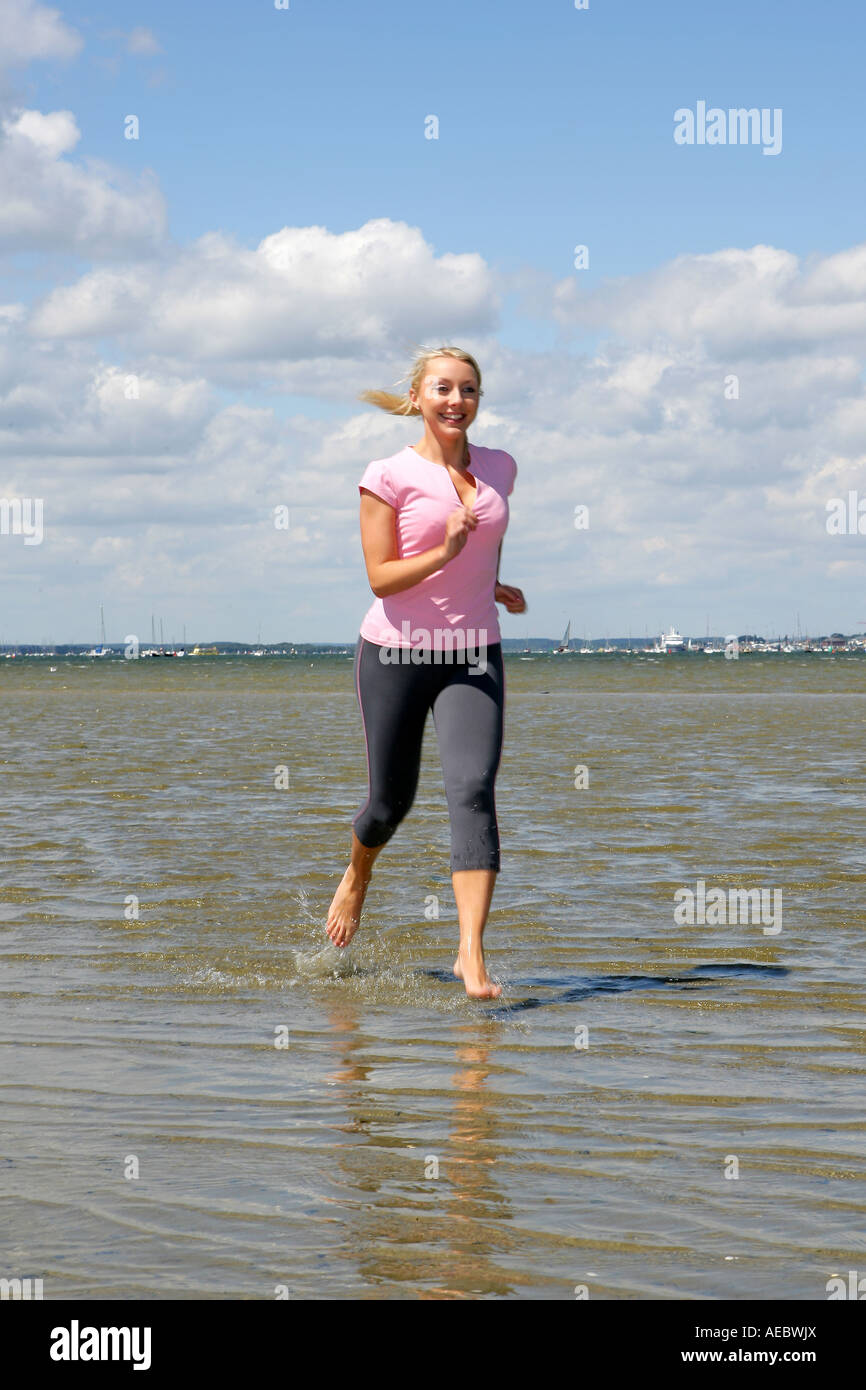 Young Woman Running Model Released Stock Photo - Alamy
