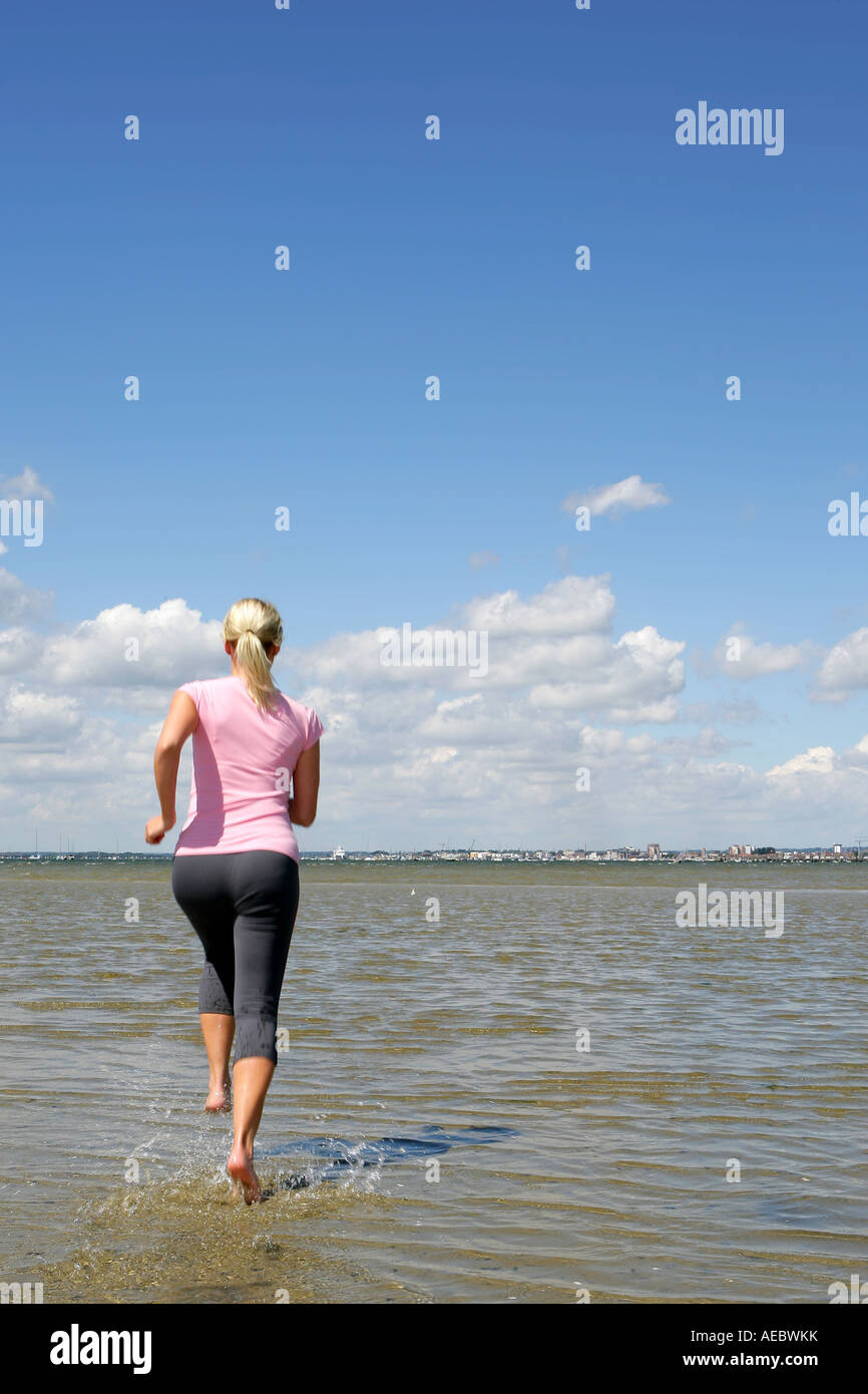 Young Woman Running Model Released Stock Photo - Alamy