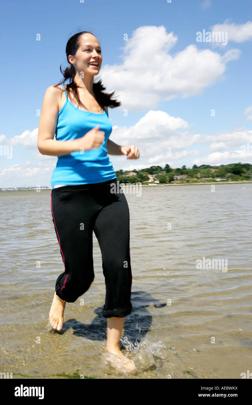 Young Woman Running Model Released Stock Photo - Alamy