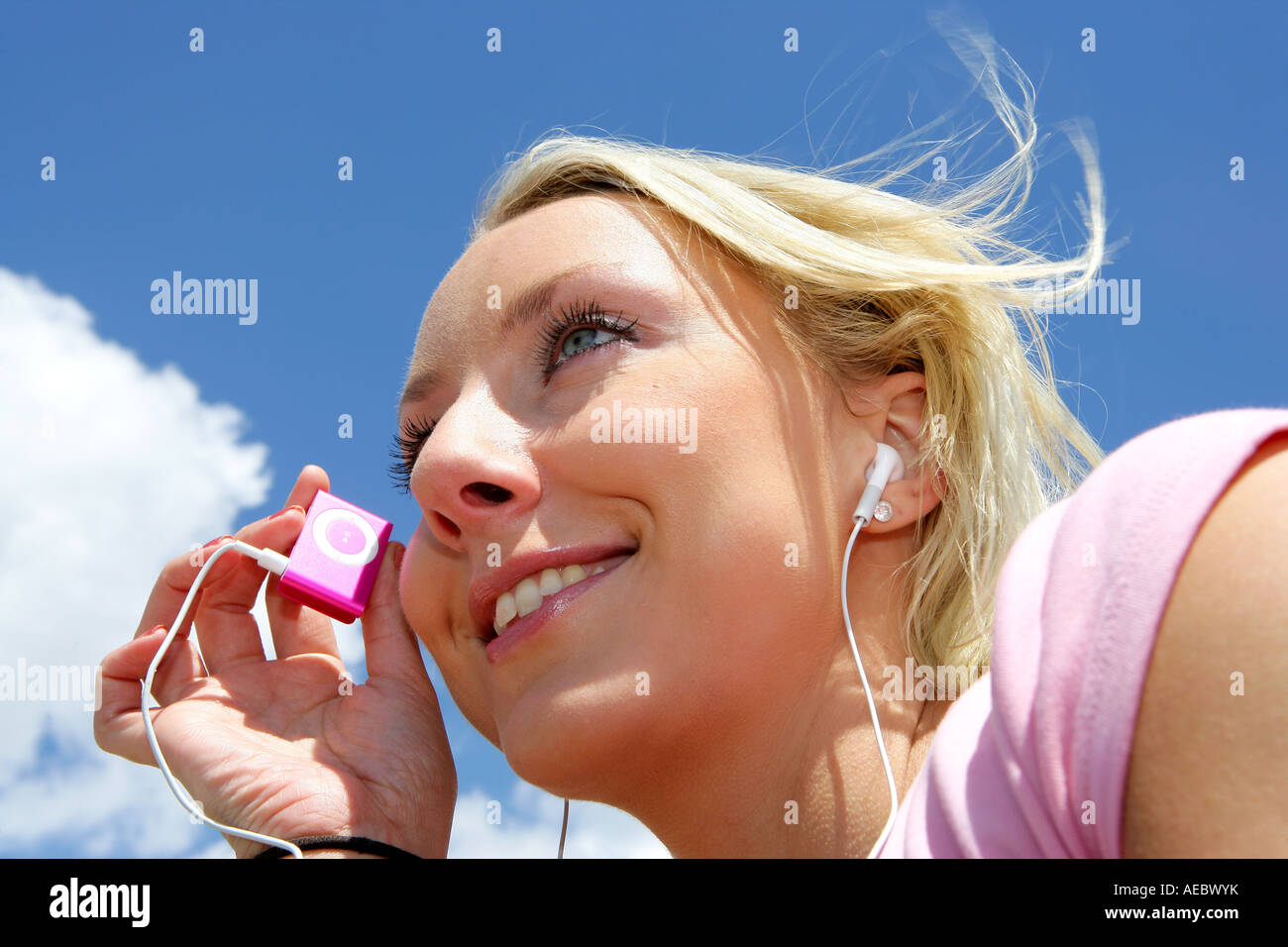 Young Woman using MP3 Player Model Released Stock Photo - Alamy