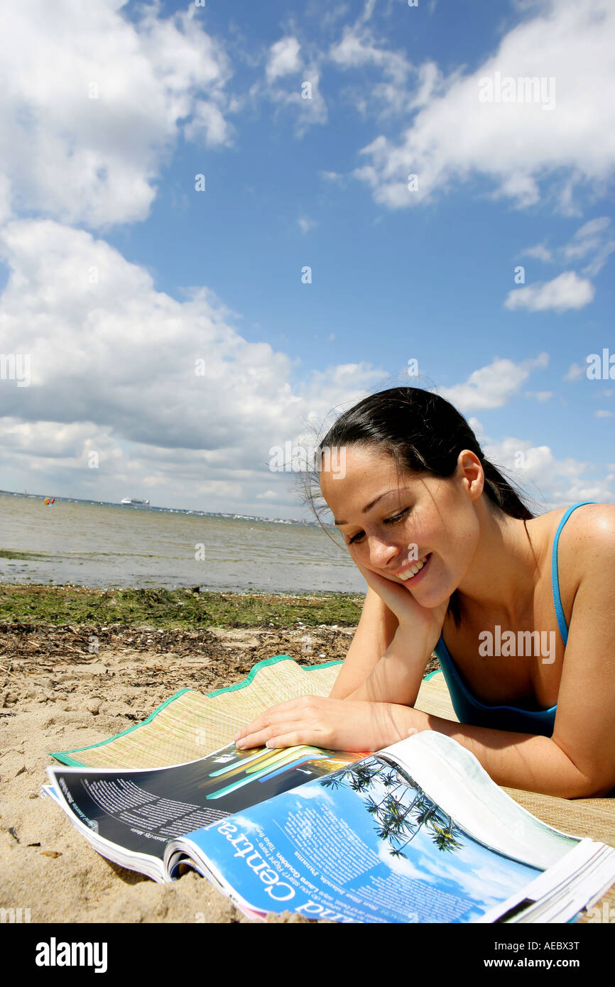 Young Woman Reading Magazine Model Released Stock Photo - Alamy
