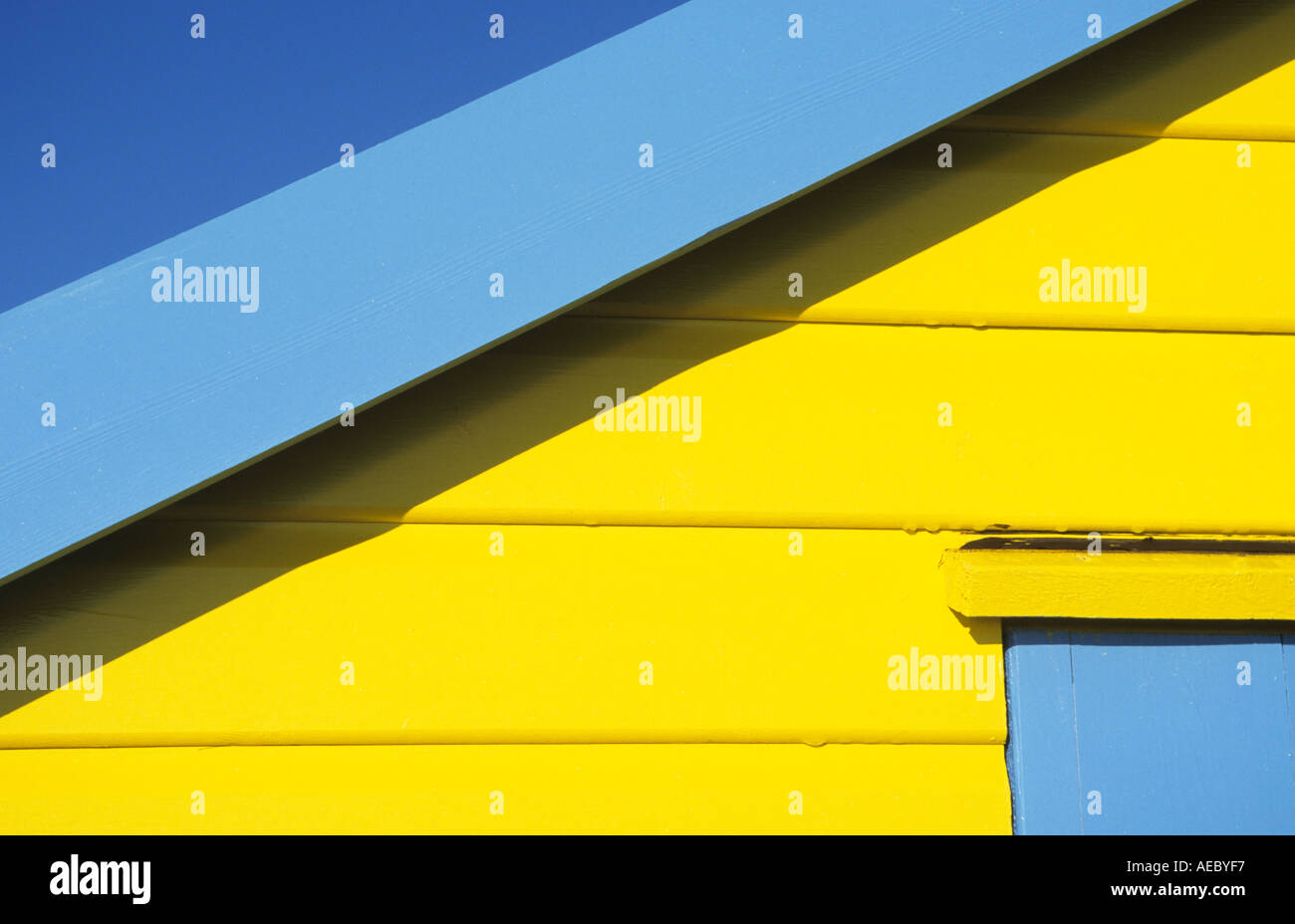Colourful blue yellow beach hut Stock Photo - Alamy