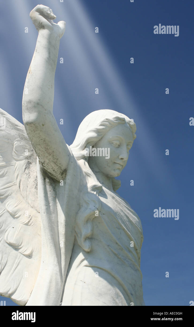 Angel Statue With Blue Sky and Light Beams Stock Photo - Alamy