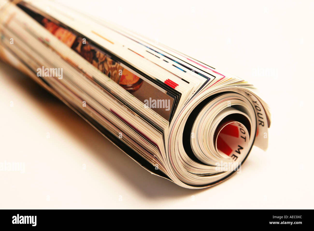 Rolled up magazine Stock Photo - Alamy