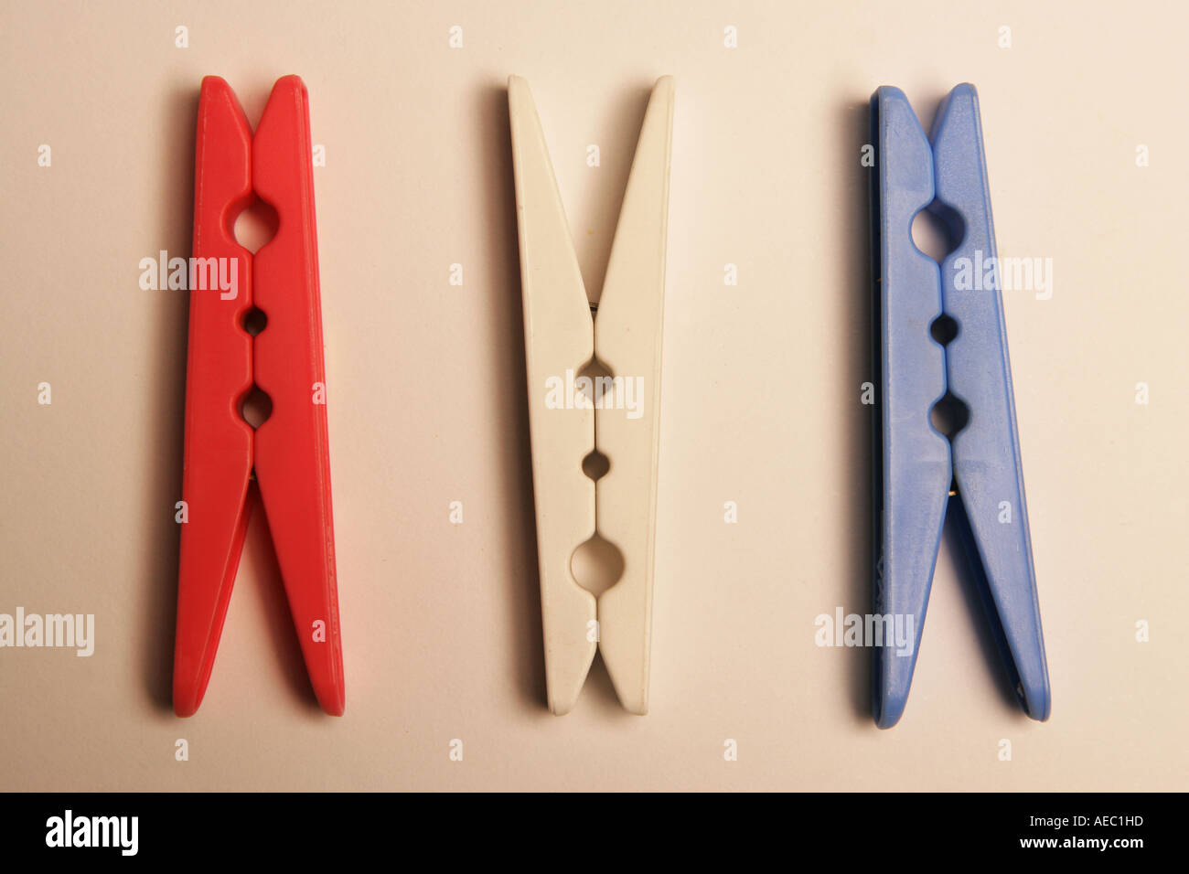 Three clothes pegs Stock Photo - Alamy